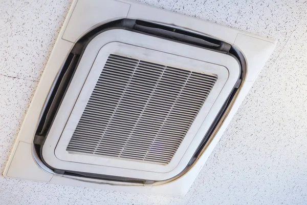 Ceiling mounted cassette type air conditioner in the modern buil Stock ...