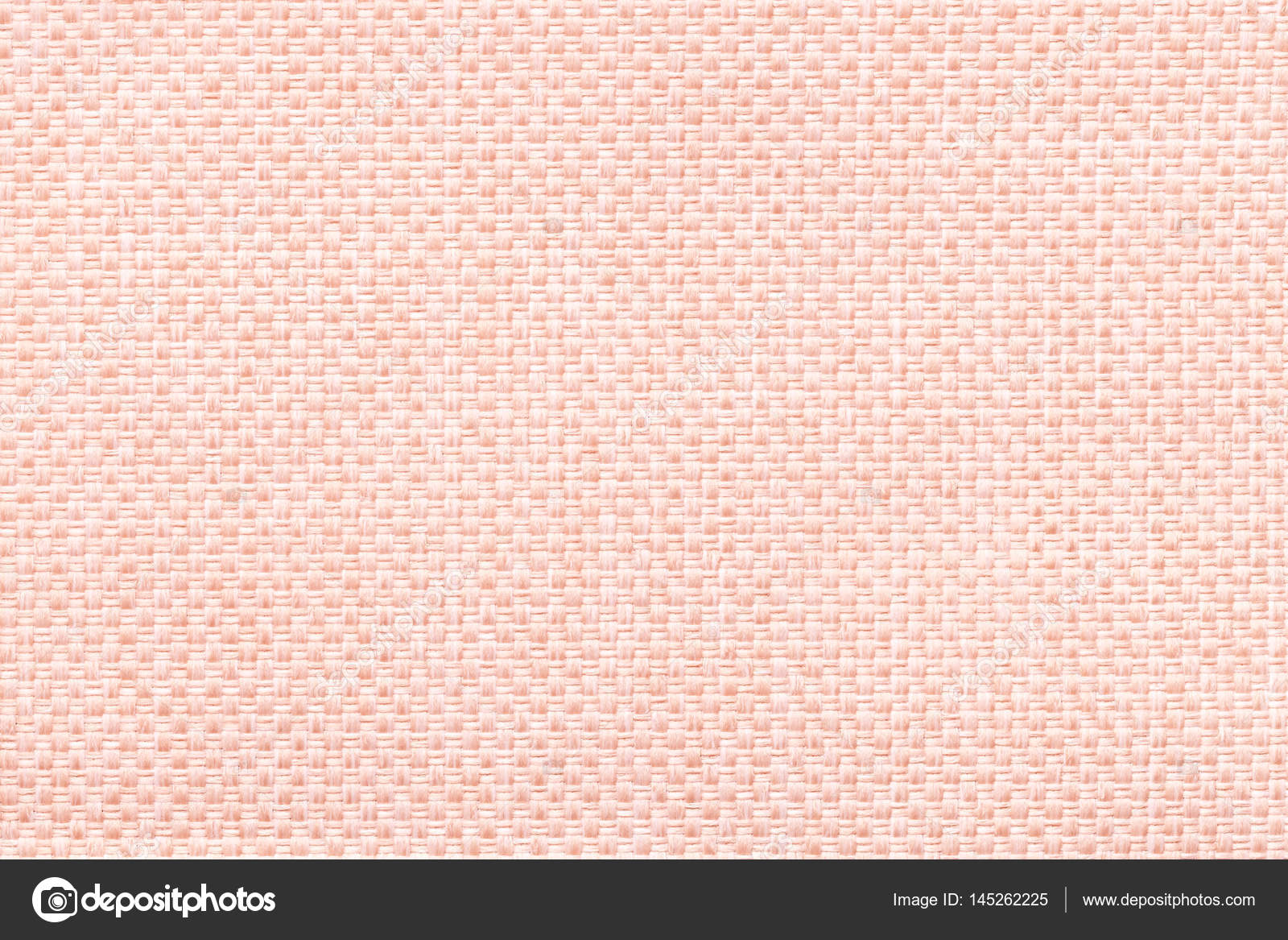 Light pink background with checkered pattern, closeup. Structure of the ...