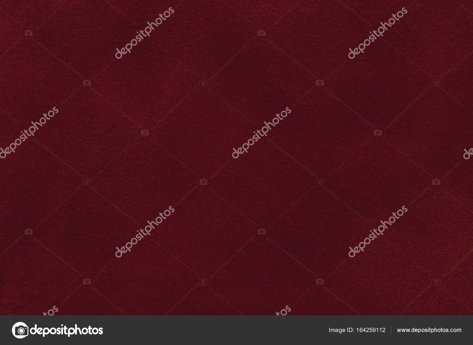 Background of dark red suede fabric closeup. Velvet matt texture of ...