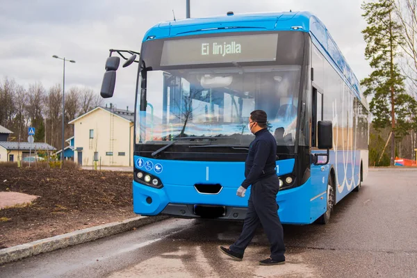 busdriver with protection gloves driving intercity bus and waiting for ...