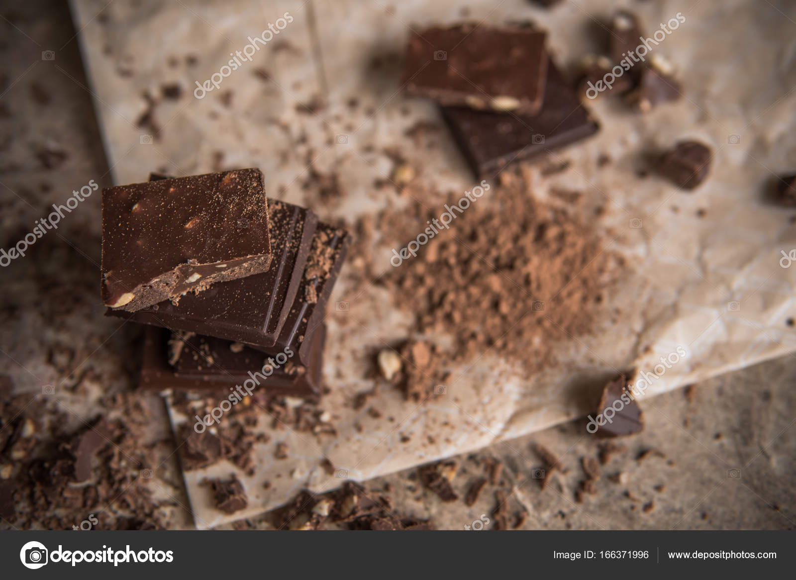 Dark chocolate stack with hazelnuts, selective focus Stock Photo by ...