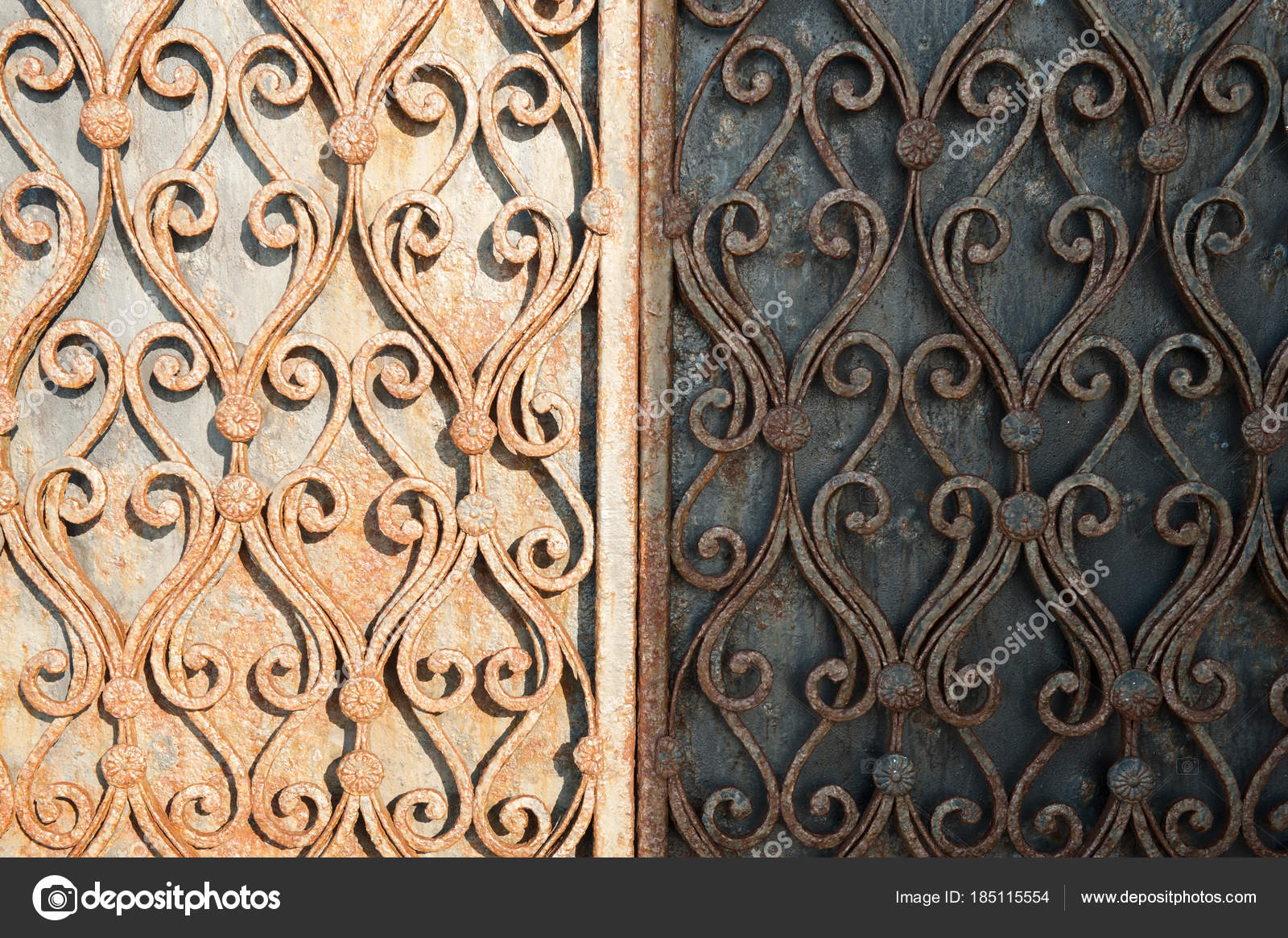 Rusty old wrought iron gates half-illuminated by the sun Stock Photo by ...