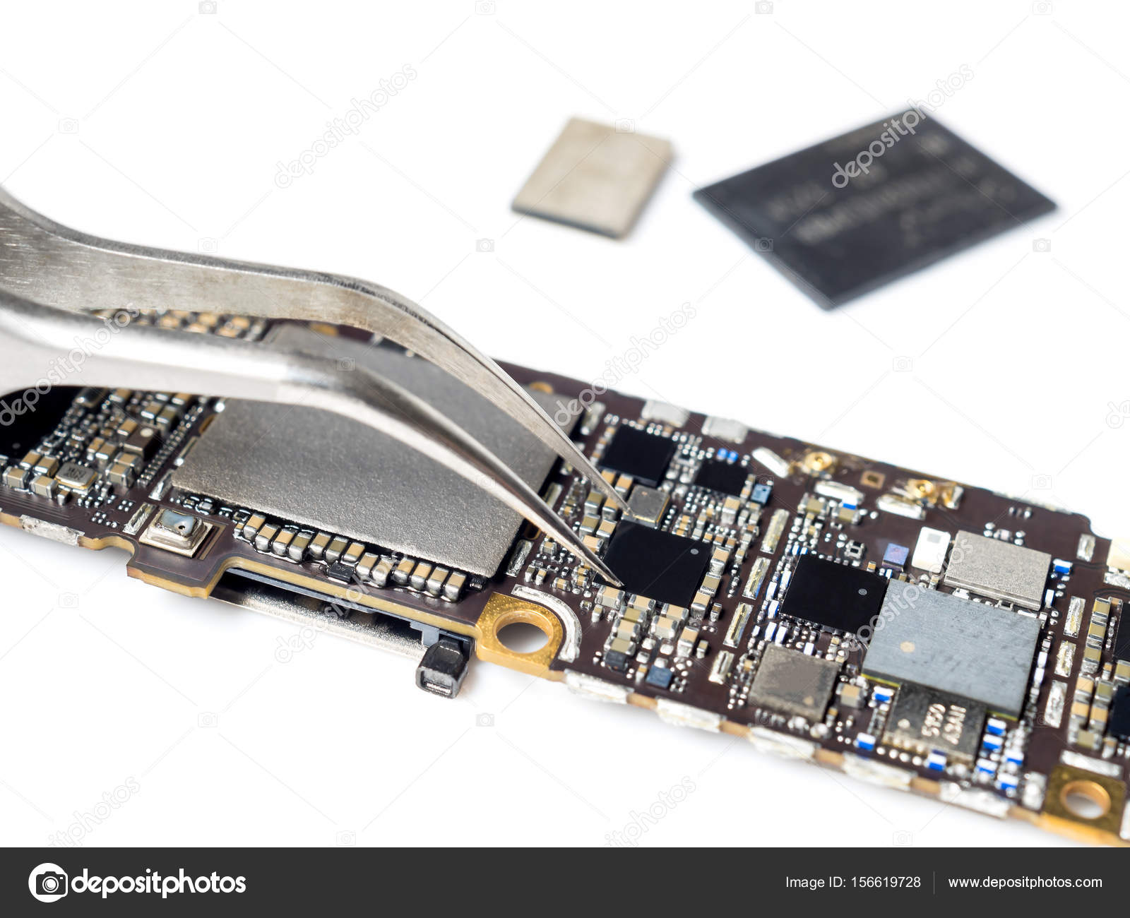 Technician replacing microchip of smartphone logic board Stock Photo by ...