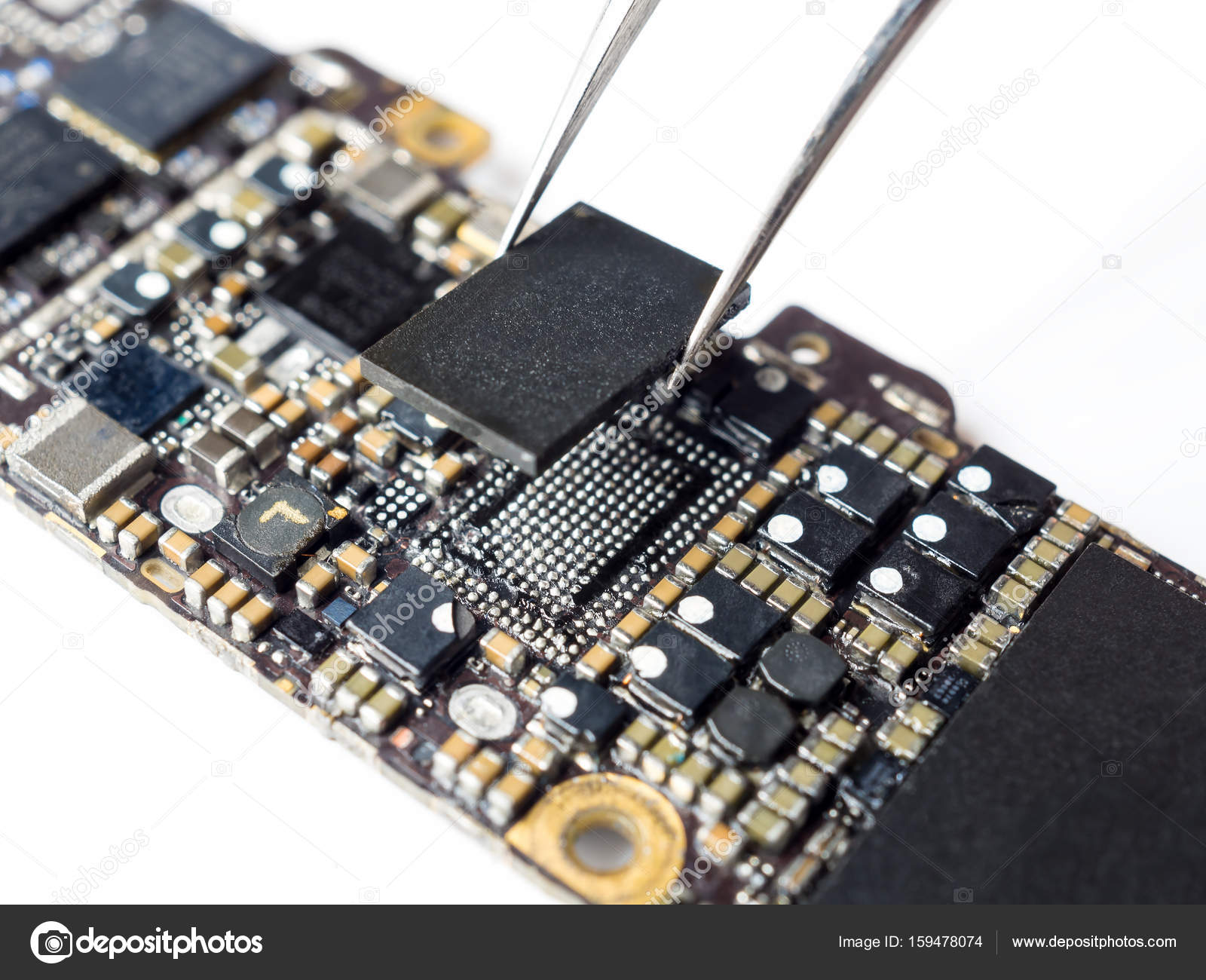 Technician replacing power IC of smartphone motherboard Stock Photo by ...