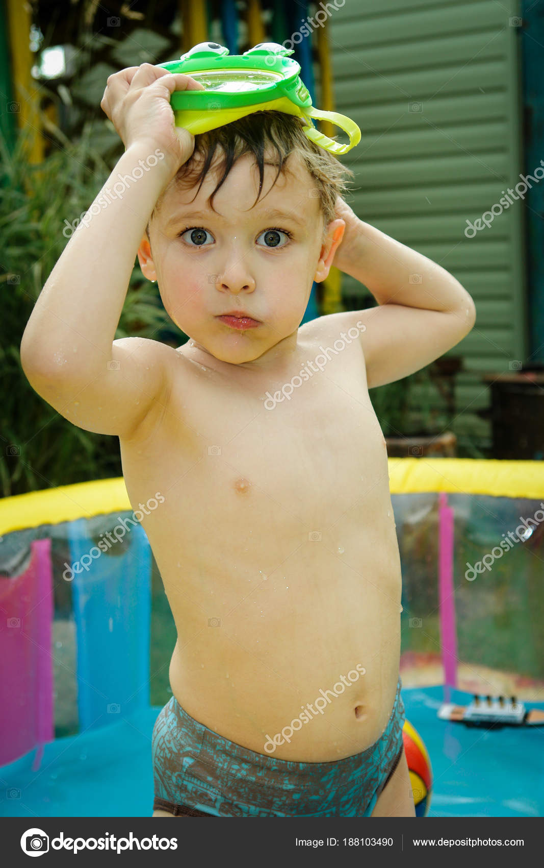 The boy in the inflatable pool — Stock Photo © ViShark #188103490