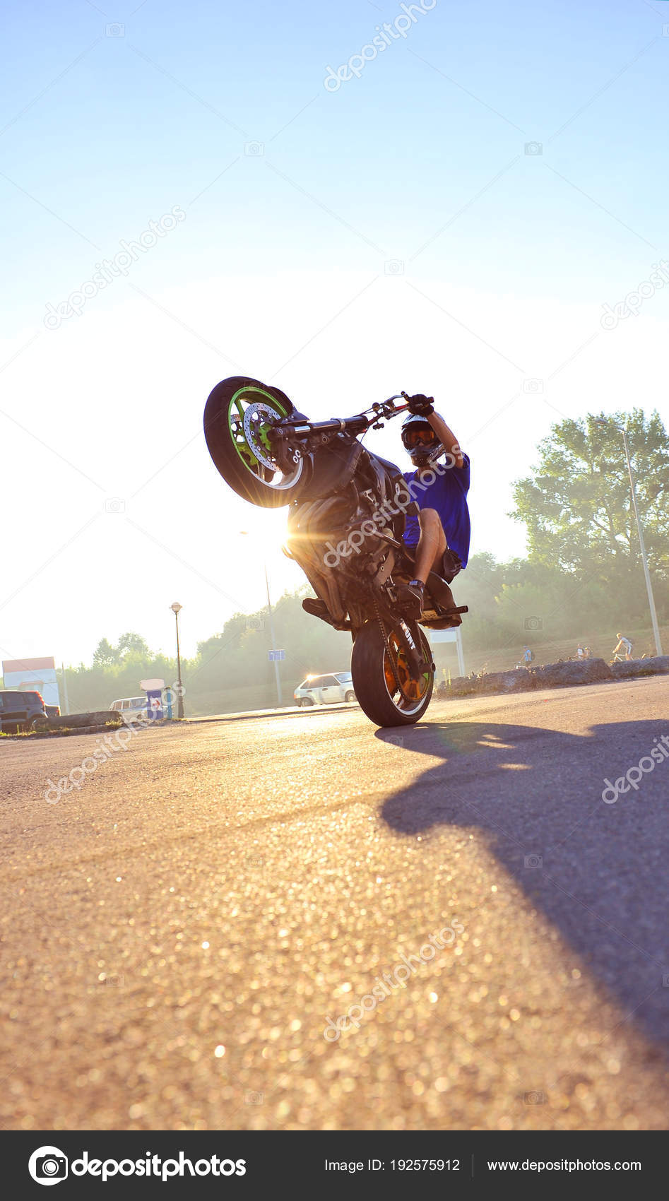 Biker standing on one cycle on summer street.. – Stock Editorial Photo ...
