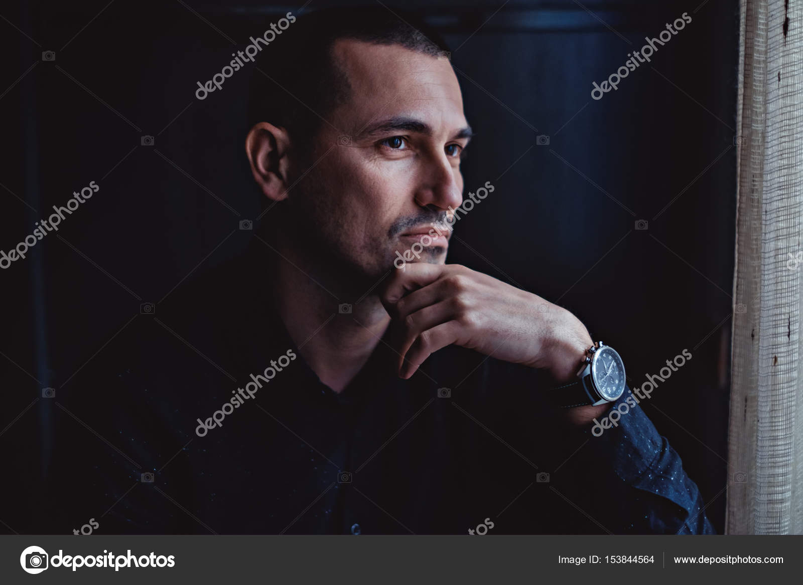 Man looking through window and thinking Stock Photo by ©sasamihajlovic ...