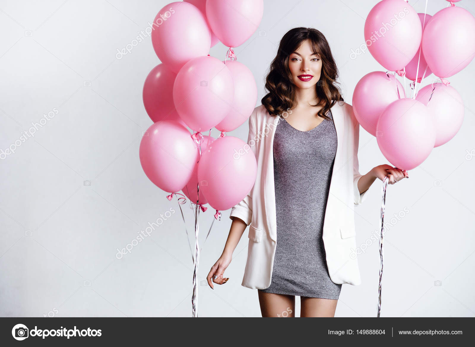 Beautiful fashion model girl with colorful balloons posing isolated on ...