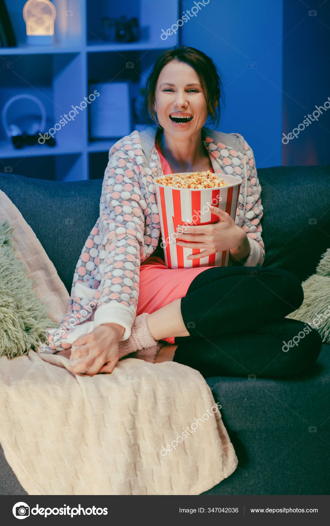 Girl face watching comedy film in home. Millennial woman sitting on ...