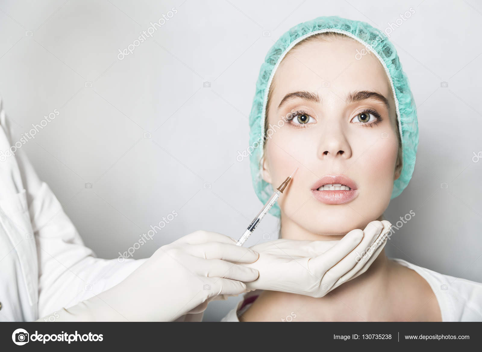 Doctor aesthetician makes face beauty injections to female patient ...