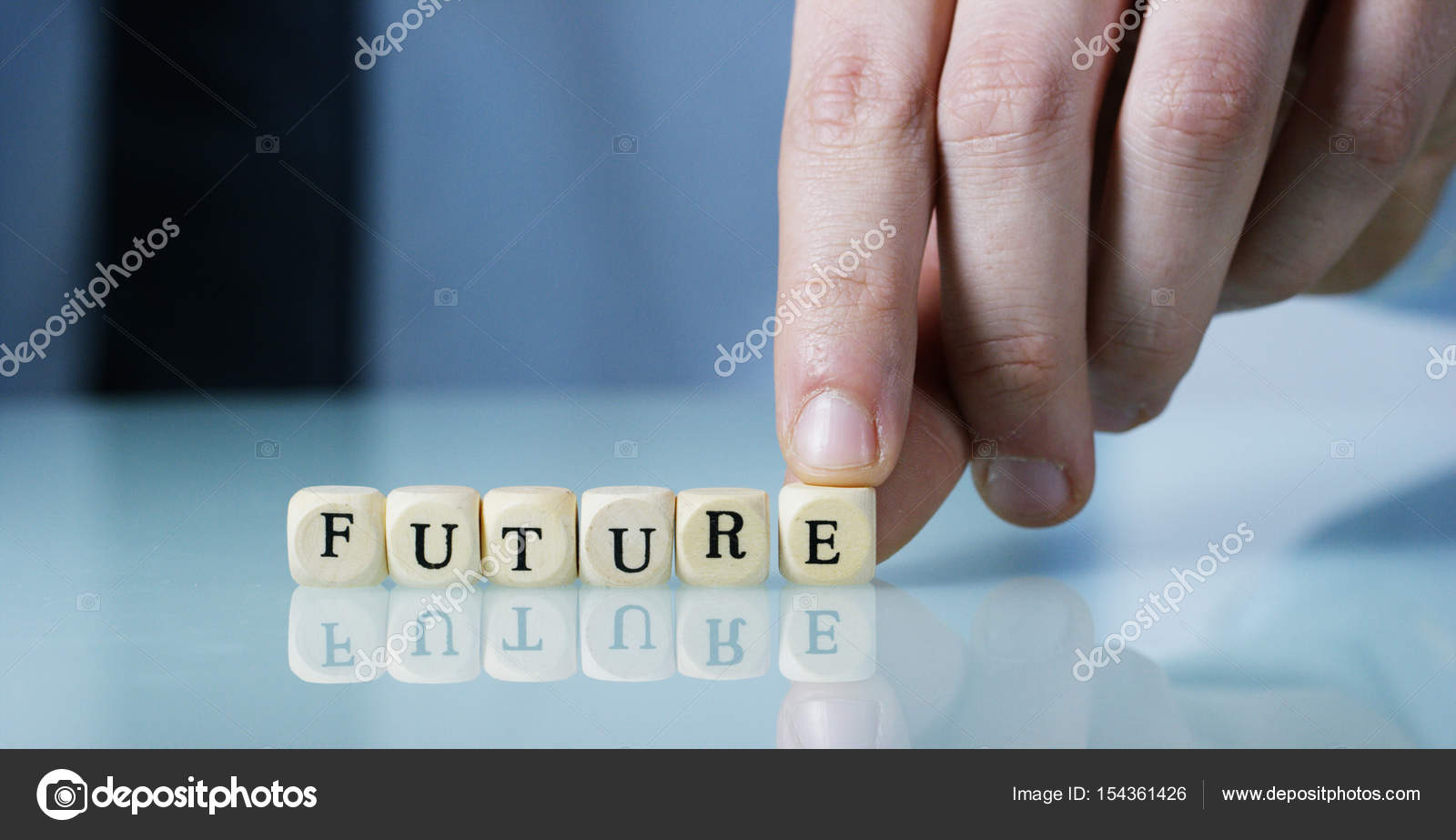 Slow motion macro of the word "Future" made of the wooden letter blocks ...