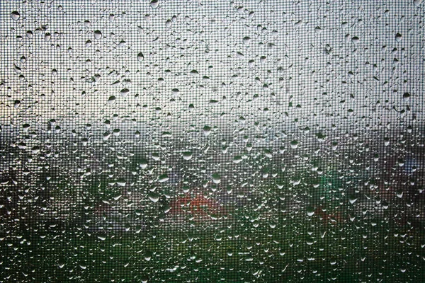 Raindrops on the glass. Rainy weather, overcast, rain thunderstorm ...