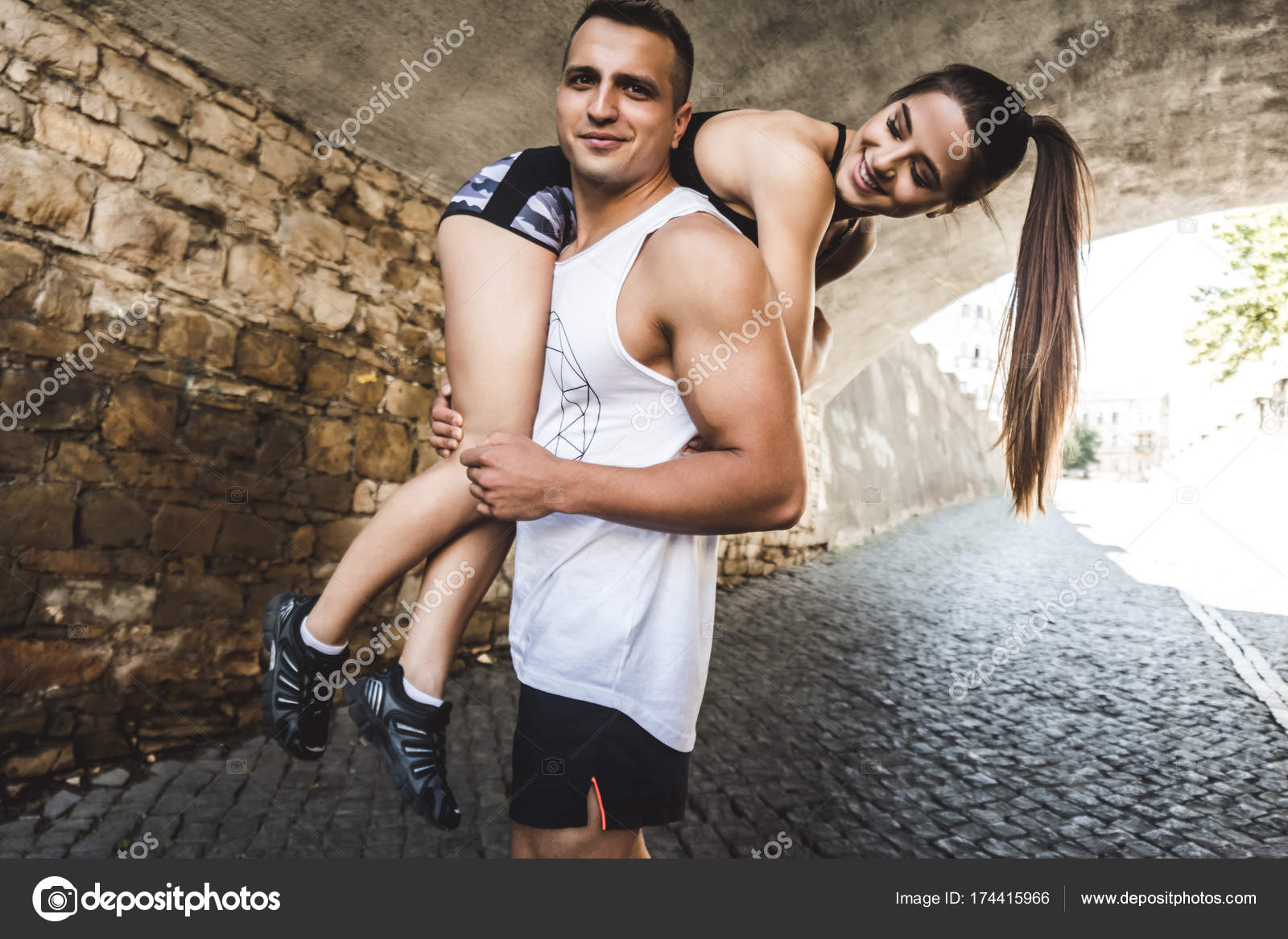 Man Carrying Woman Over Shoulder