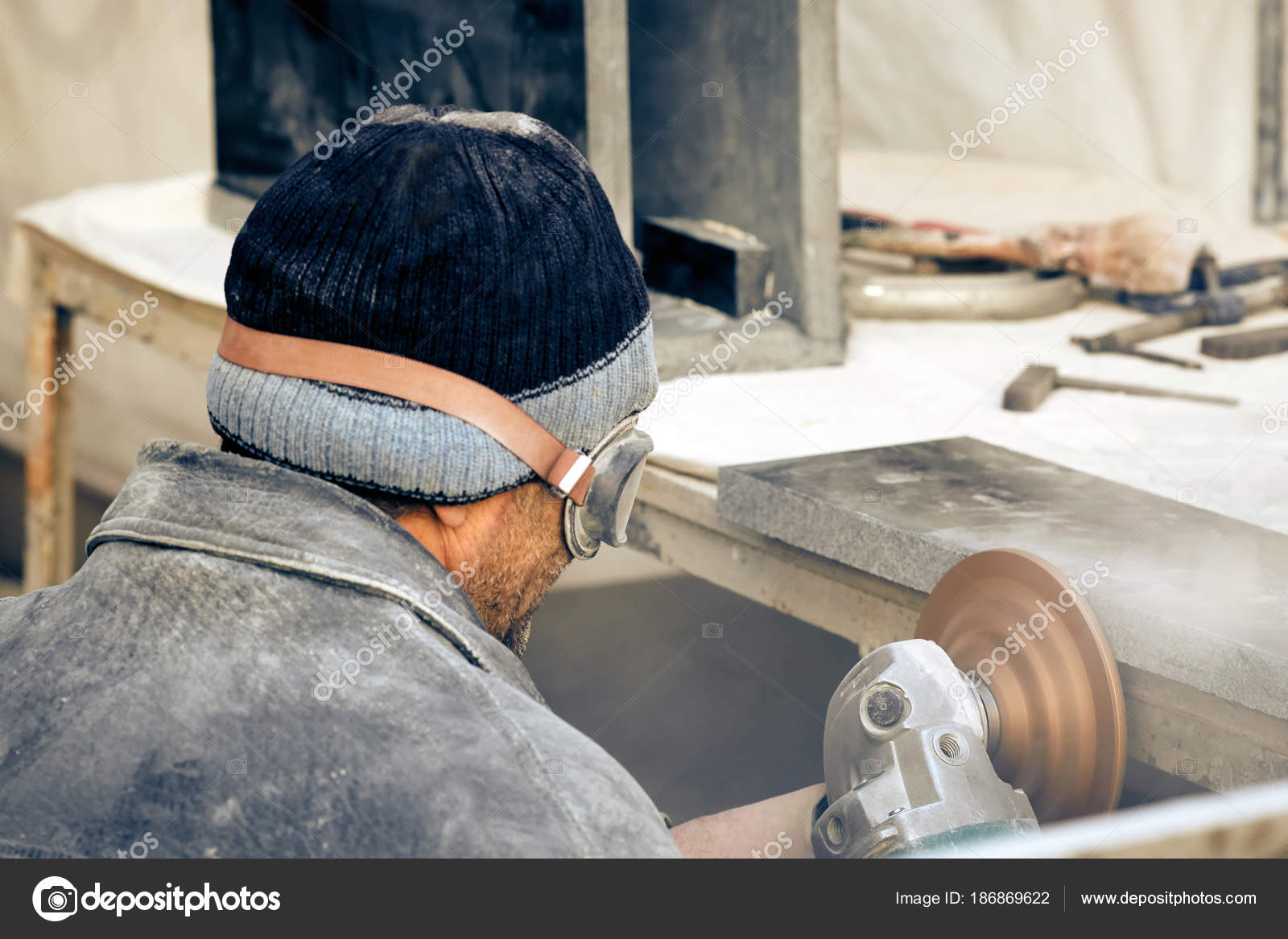 The worker processes the granite stone with a grinder. — Stock Photo ...