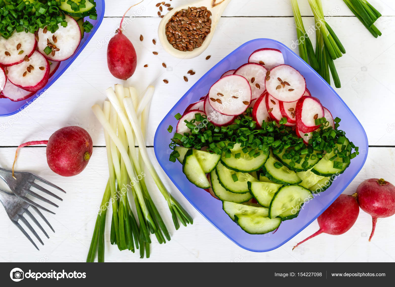 A light vitamin spring - summer salad with fresh cucumbers, radish and ...