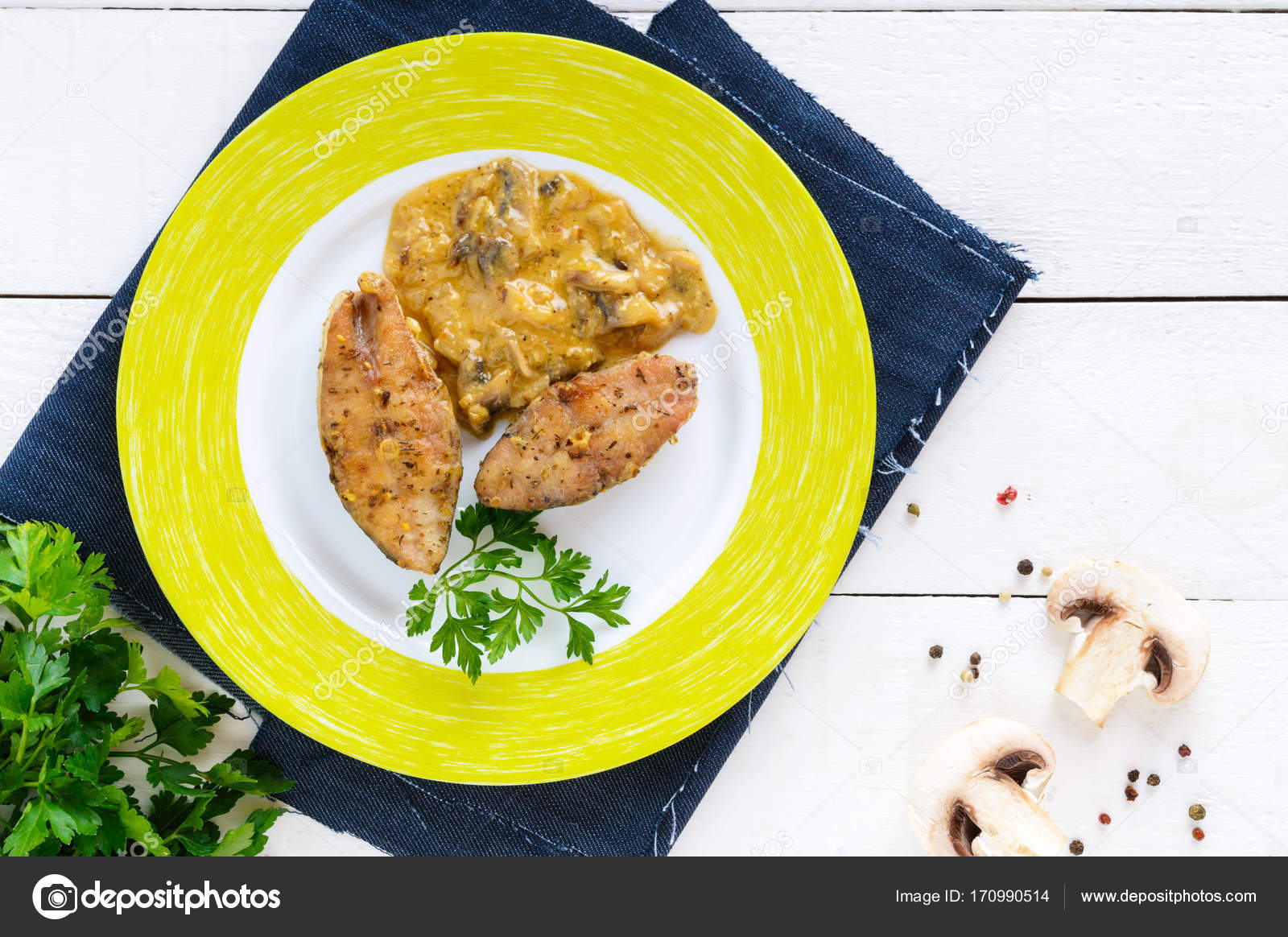 Roasted carp steaks with mushroom sauce on a plate Stock Photo by ...