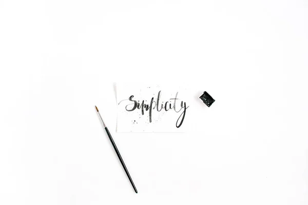 Minimalistic stylish composition with word Simplicity — Stock Photo ...