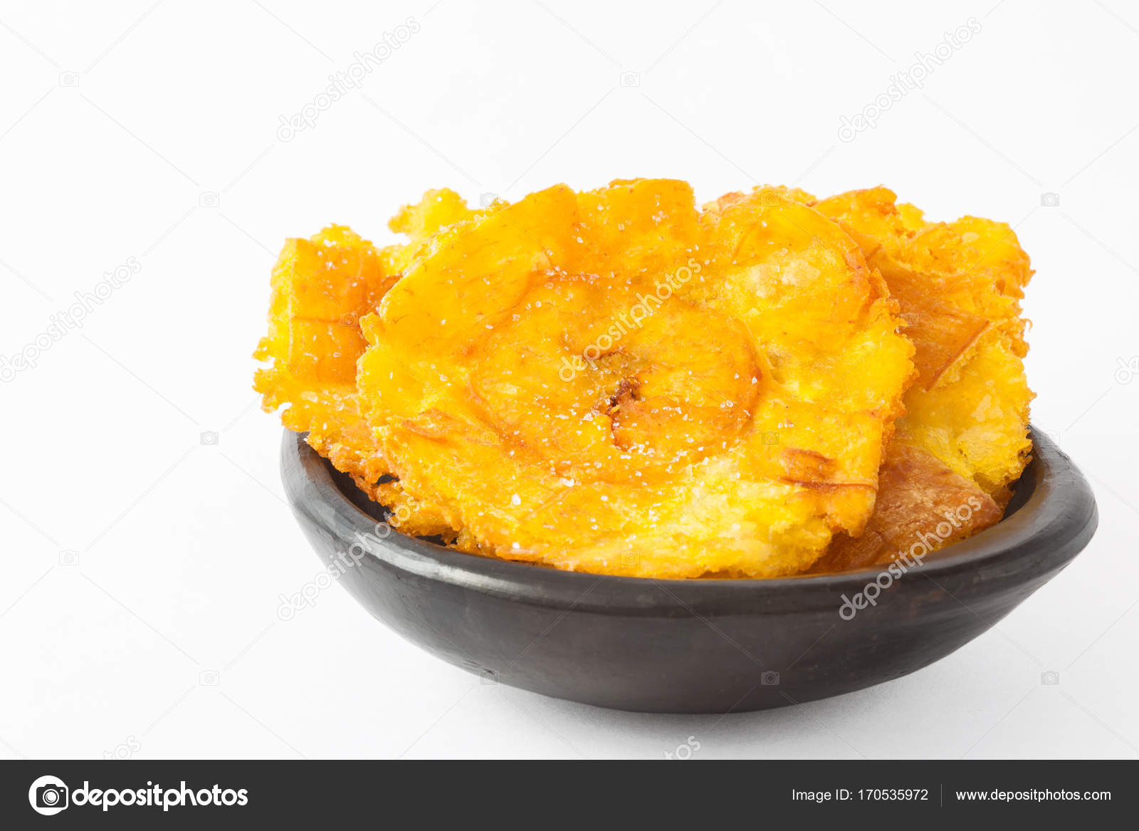 Plantain patacones on black dish Stock Photo by ©anamejia18 170535972