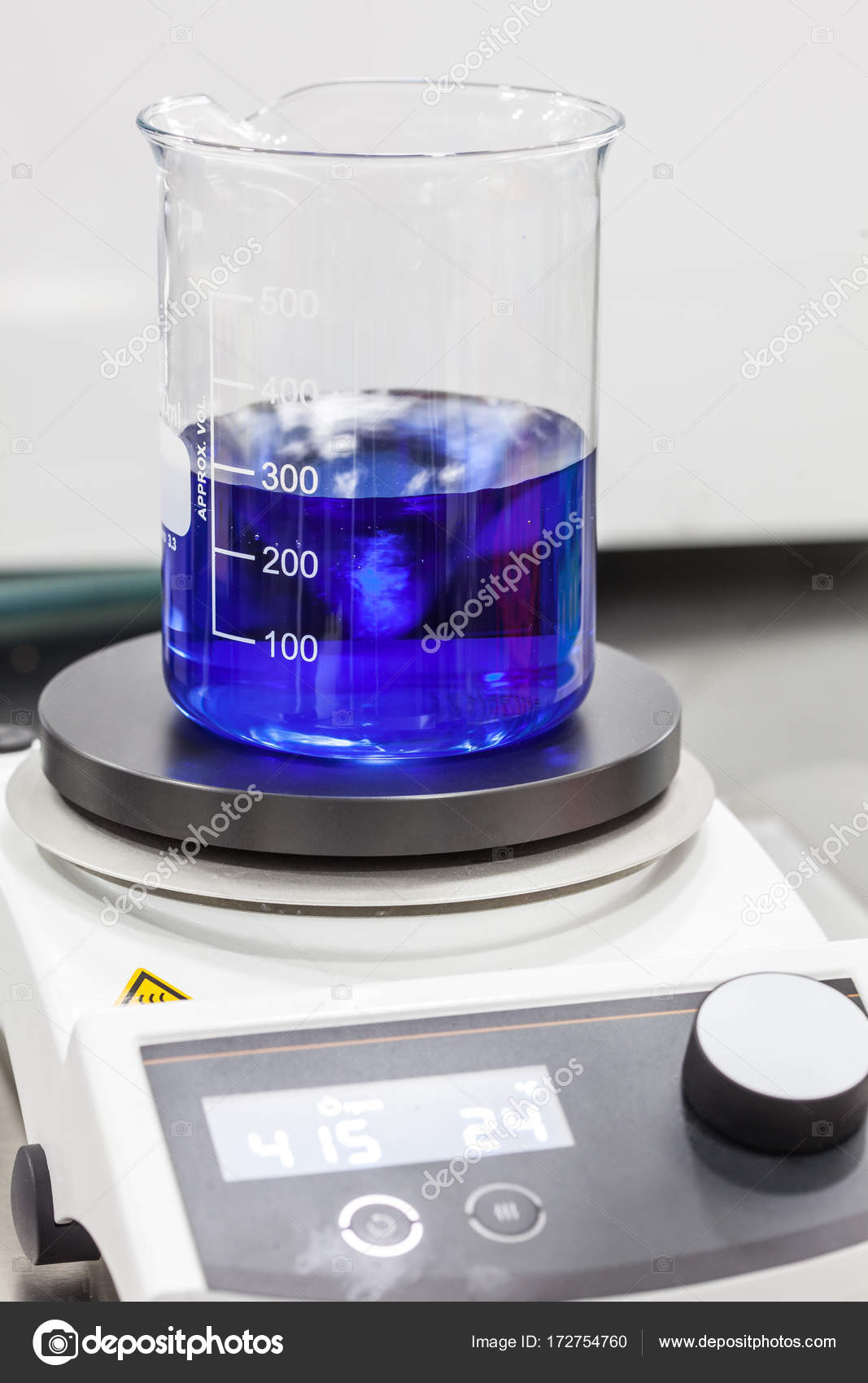 Beaker on top of a magnetic laboratory stirrer — Stock Photo ...