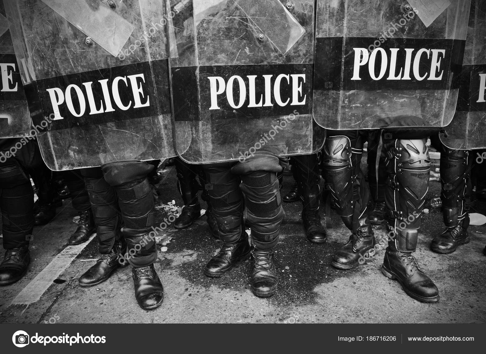 Bottom View Policemen Legs Shields — Stock Photo © 1000Words #186716206