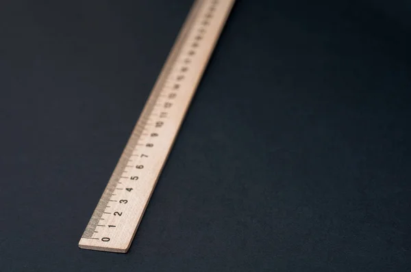 Male hand with wooden ruler isolated Stock Photo by ©serzh148 133071610