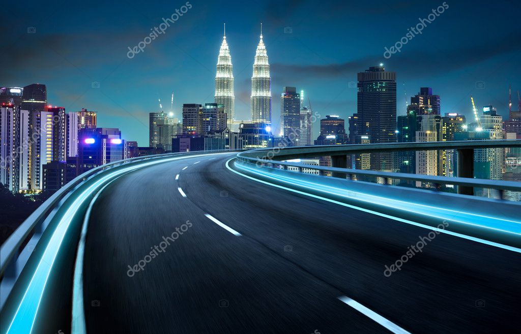 Highway overpass against city Stock Photo by ©jamesteohart 125943032