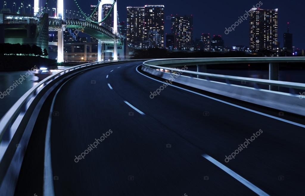 Neon light highway over cityscape Stock Photo by ©jamesteohart 127679904