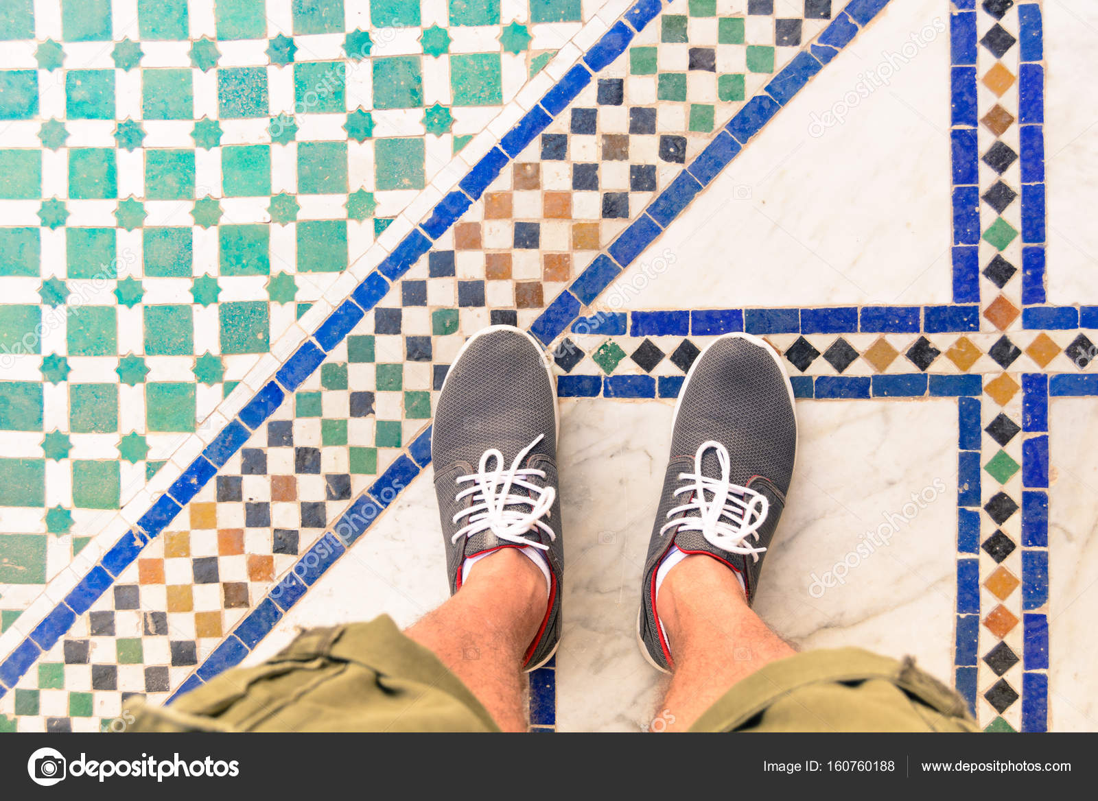 Feet selfie from upper view of man traveler in sneaker during a tour ...
