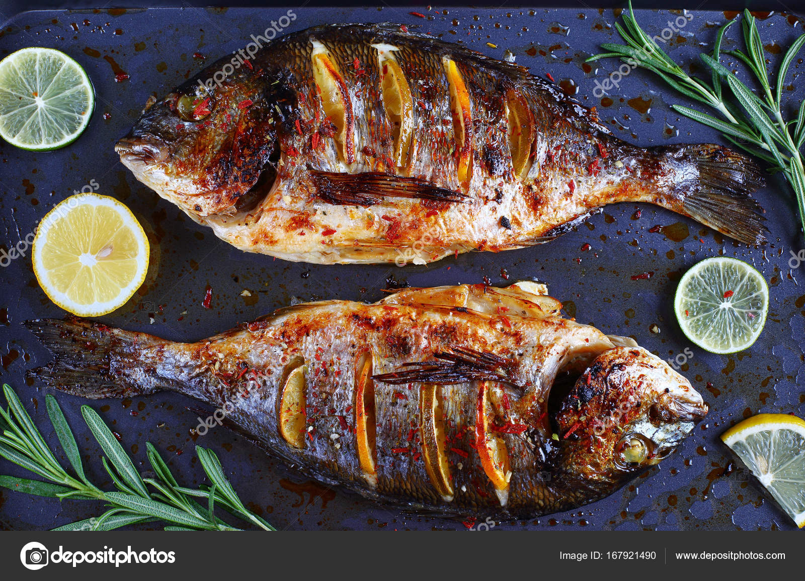 Roasted sea bream fish with lemon slices Stock Photo by ©myviewpoint ...