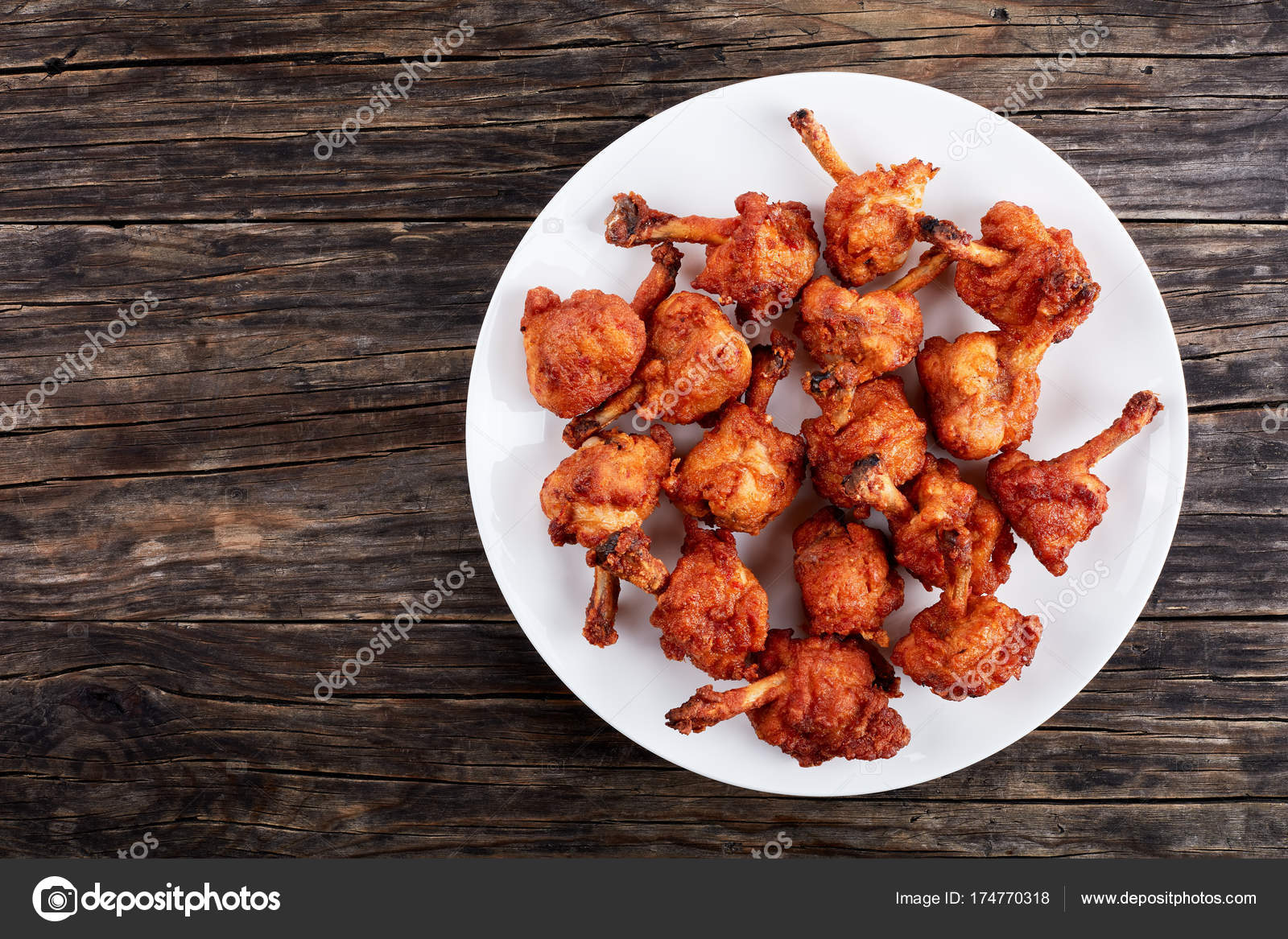 Crispy chicken winglets with exposed bones Stock Photo by ©myviewpoint ...