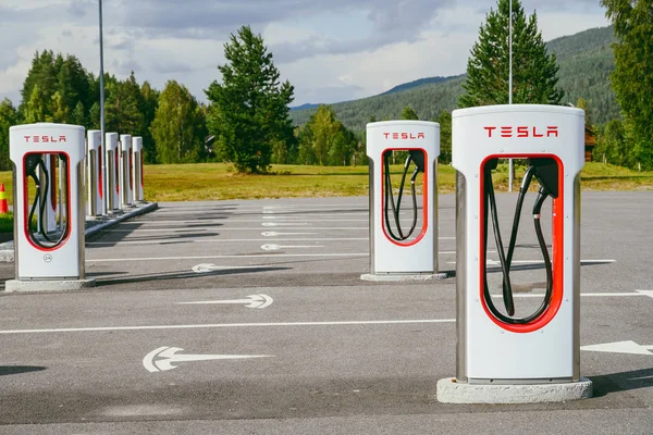 Details of a Tesla electric supercharger stand at a gas station in ...