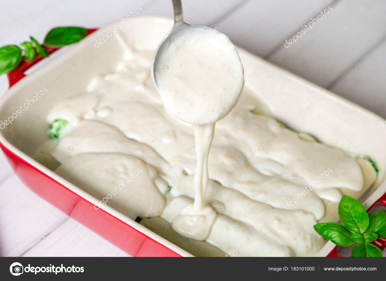 Pouring bechamel sauce on cannelloni. Stock Photo by ©komarina.nsk ...