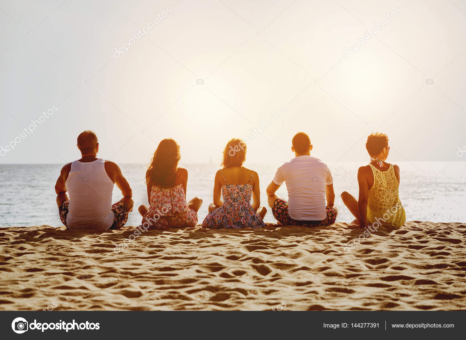 Group of five friends on beach Stock Photo by ©cppzone.mail.ru 144277391