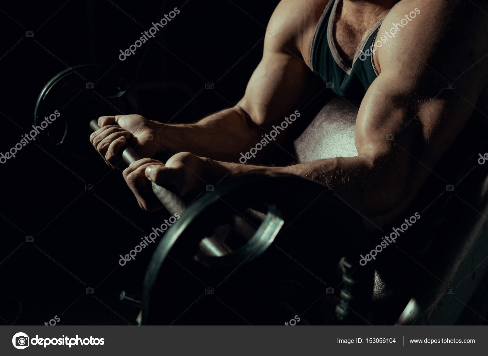 Hands of an athlete close-up, which does an exercise with a barbell ...