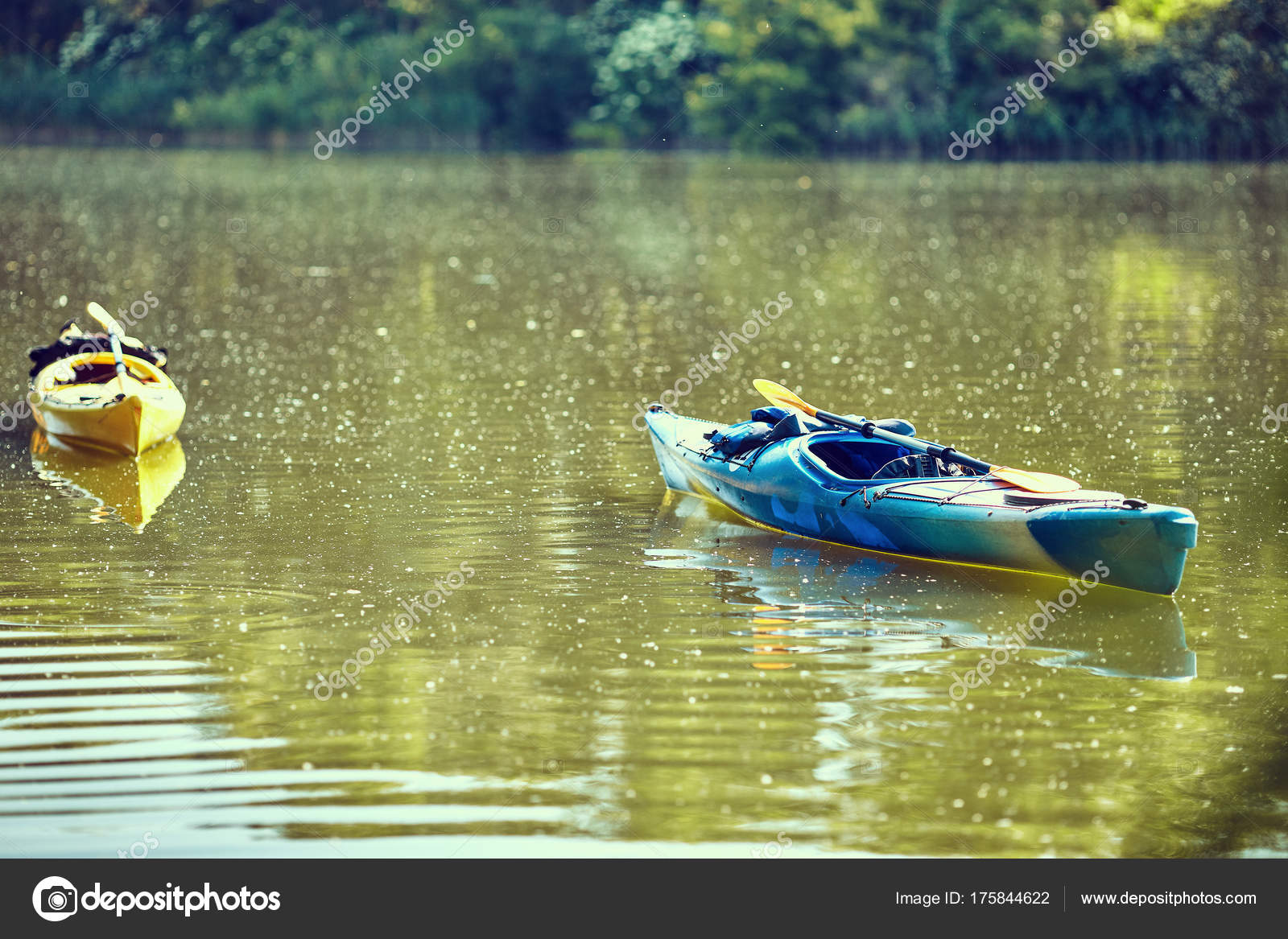 Kayaks moored in the water. Empty kayaks without people. Stock Photo by ...