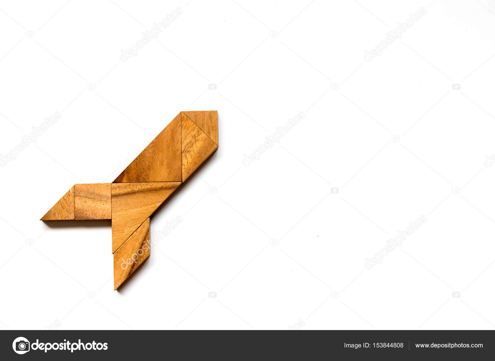 Wooden tangram puzzle in rocket shape on white background (Concept for ...