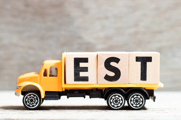 Truck hold letter block in word est (abbreviation of established ...