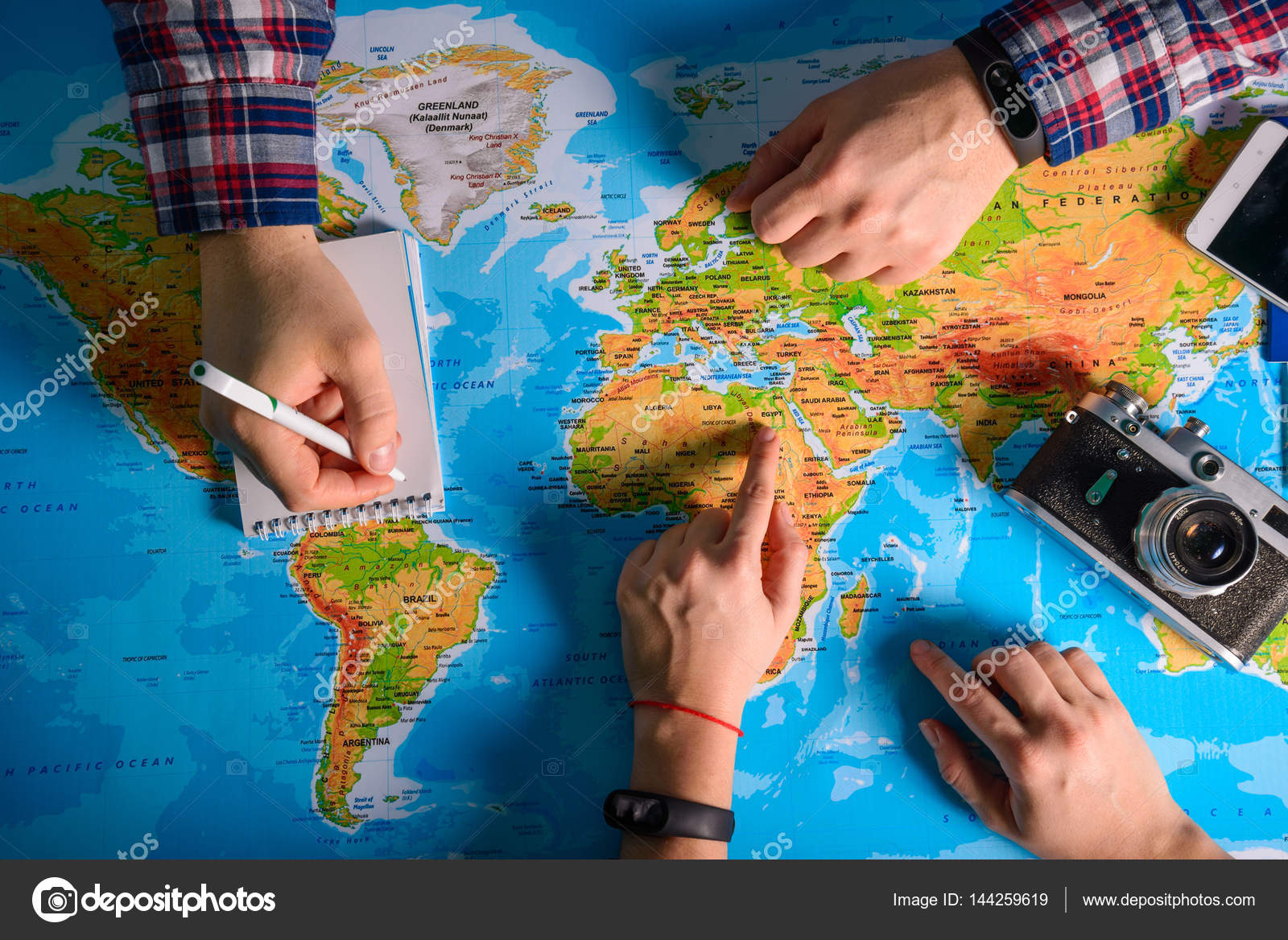 Hands point on map where to go Stock Photo by ©Vera_Petrunina 144259619