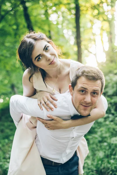 woman jump on mans back, - Stock Image - Everypixel