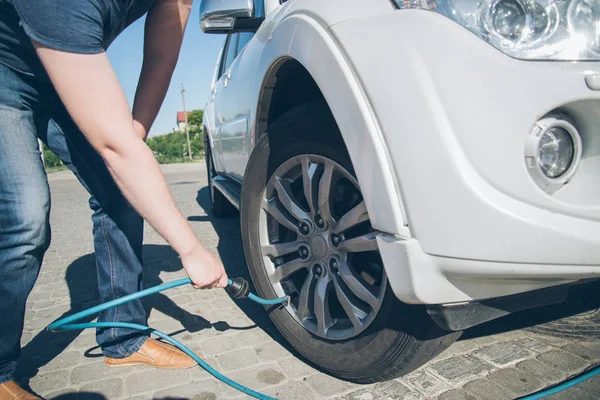 Checking tires Stock Photos, Royalty Free Checking tires Images ...