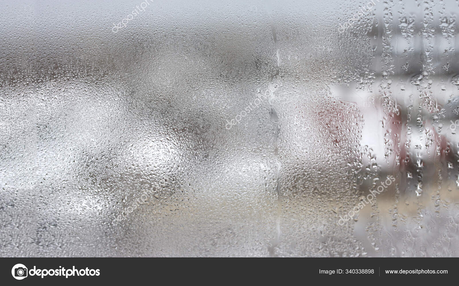 High humidity in the form of condensation on a transparent glass ...