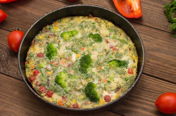 Spanish tortilla in the pan. Wooden rustic table. Top view Stock Photo ...