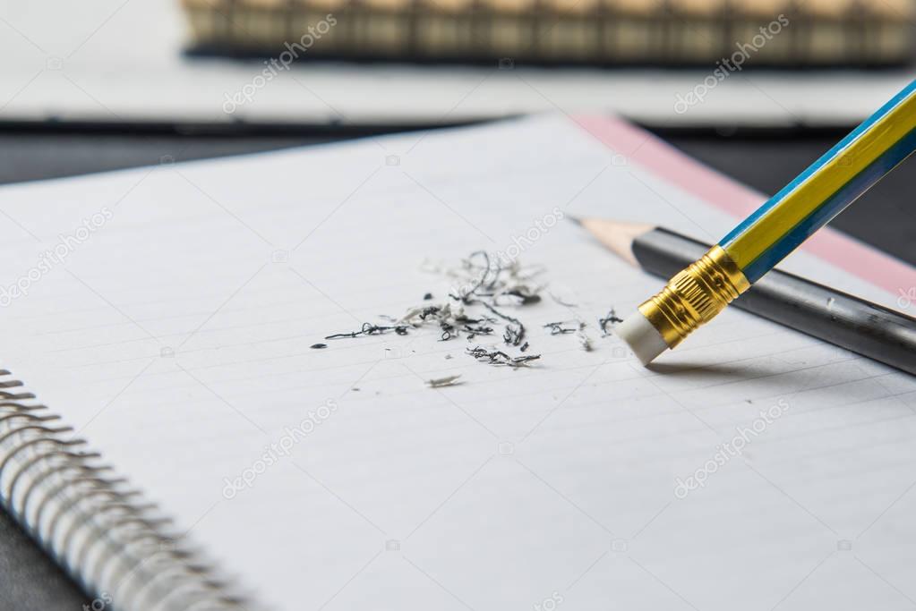Pencil eraser dust on notebook — Stock Photo © Littlewitz #166844256