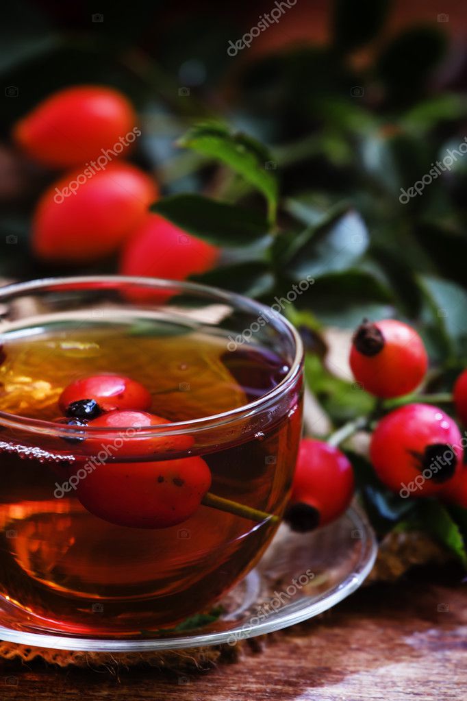 Healing black tea with wild rose berries in a glass cup — Stock Photo ...
