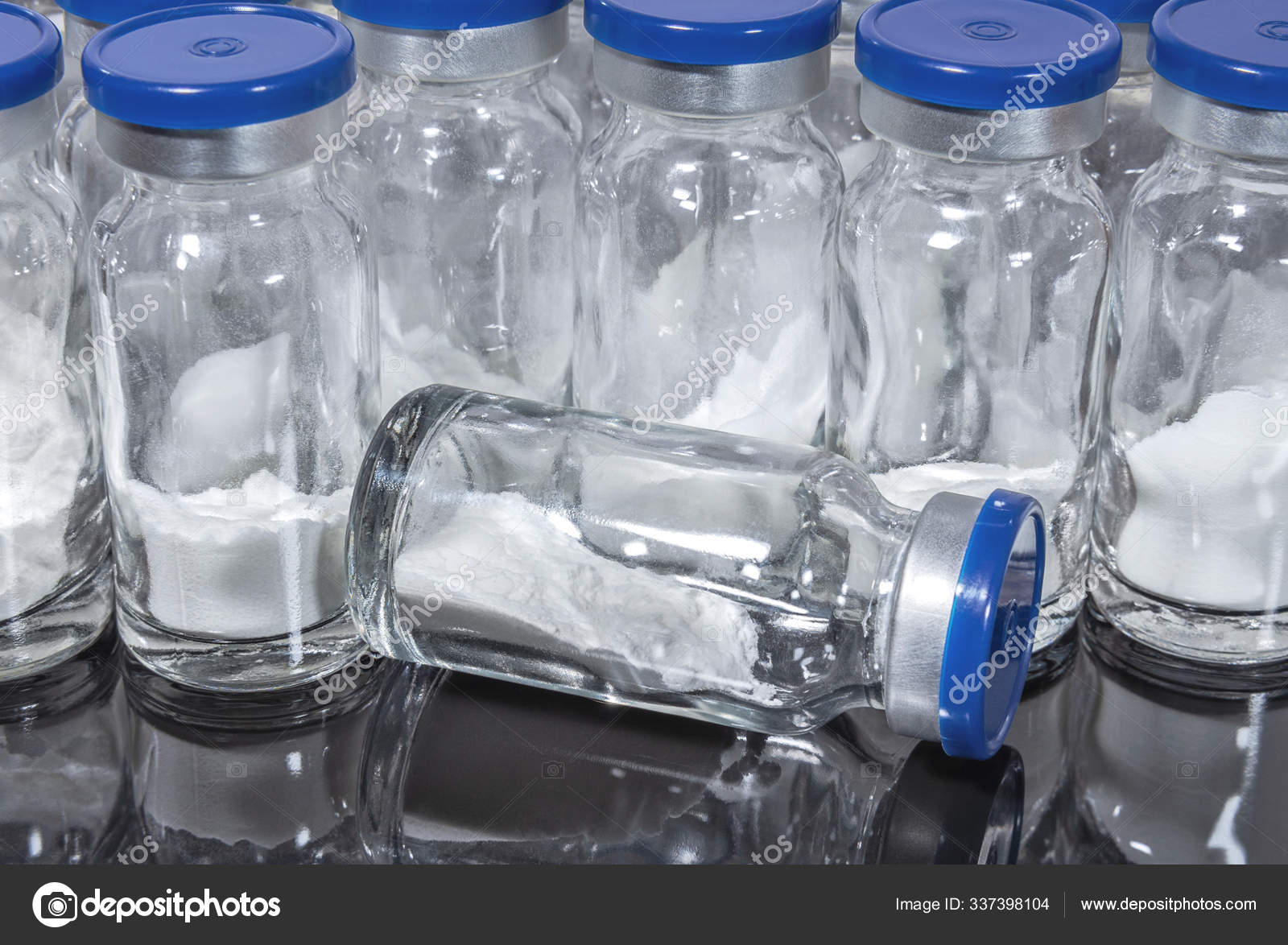 Medical vials with white powder vaccine Stock Photo by ©Looka 337398104