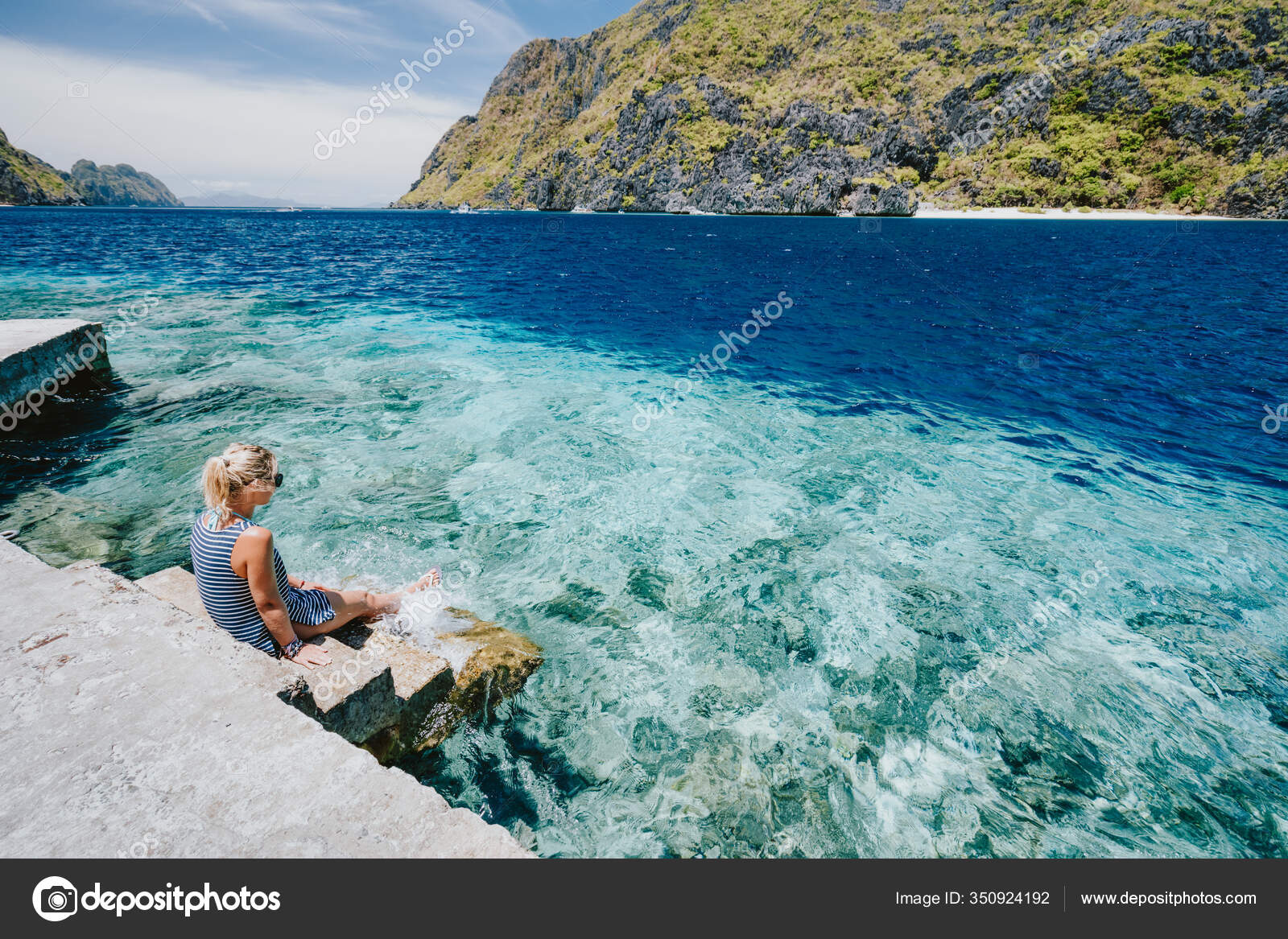 El Nido, Palawan, Philippines. Tourist female on Matinloc dock pier ...