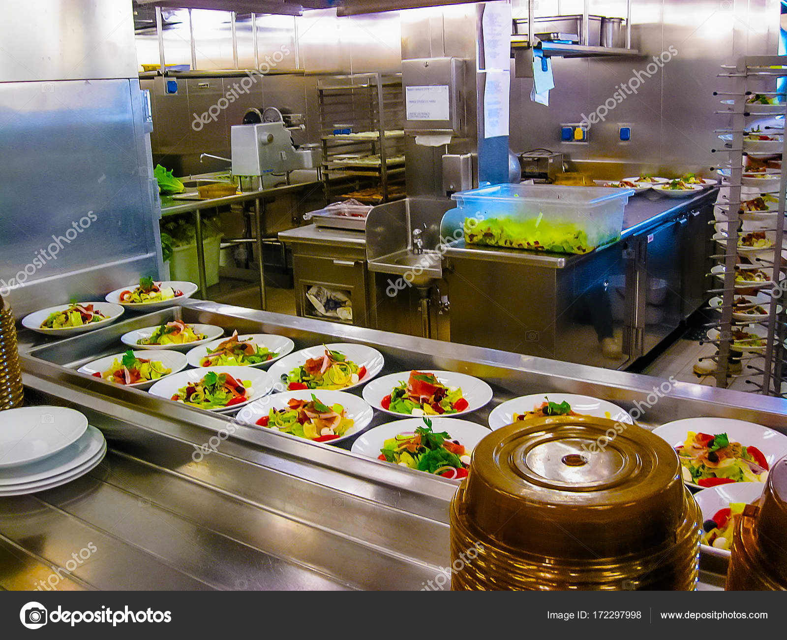 The kitchen with plates ready for serving dinner on a cruise ship ...