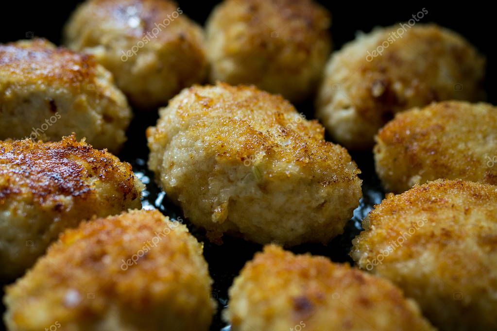Meatball in a pan while frying, Frying large homemade meatballs on a ...