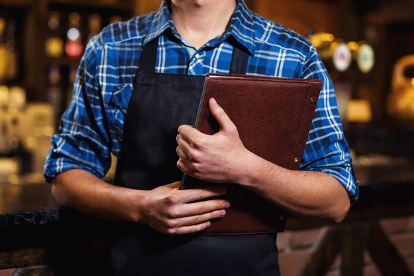 Barman at work in pub,Portrait of cheerful barman worker standing ...