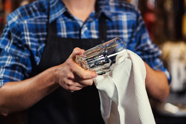 Barman at work in pub,Portrait of cheerful barman worker standing ...